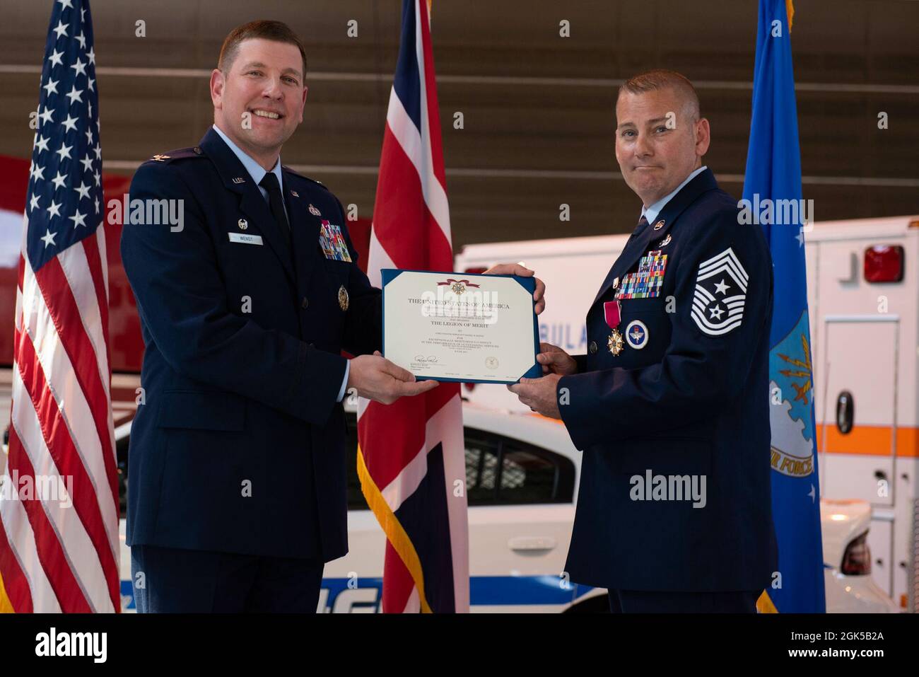 U.S. Air Force Chief Master Sgt. Daniel Keene, right, 501st Combat Support Wing command chief ...