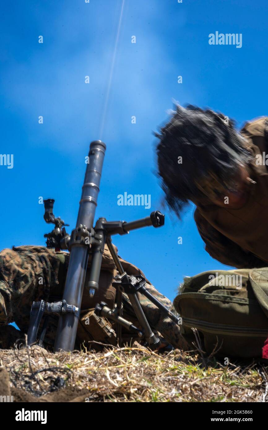 U.S. Marines with 1st Battalion, 3d Marines fire a 60mm mortar system ...