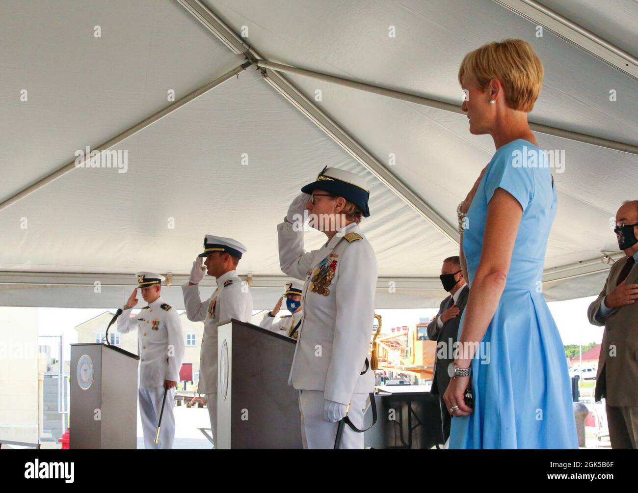 Members stand for the national anthem during the Coast Guard Cutter ...