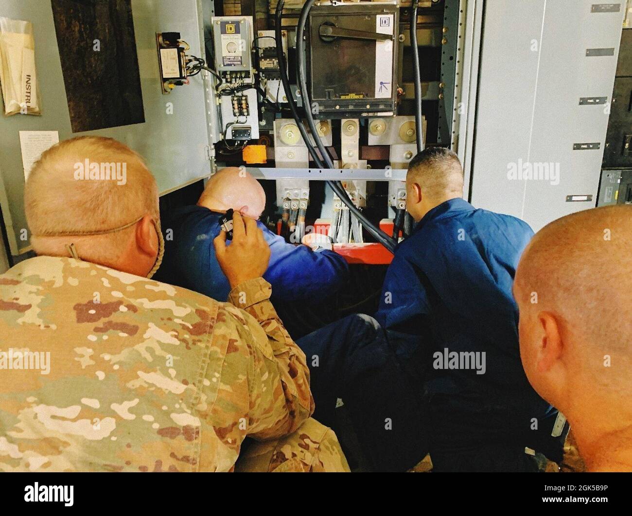 Members of the 118th Civil Engineer Squadron prepare to attach ...