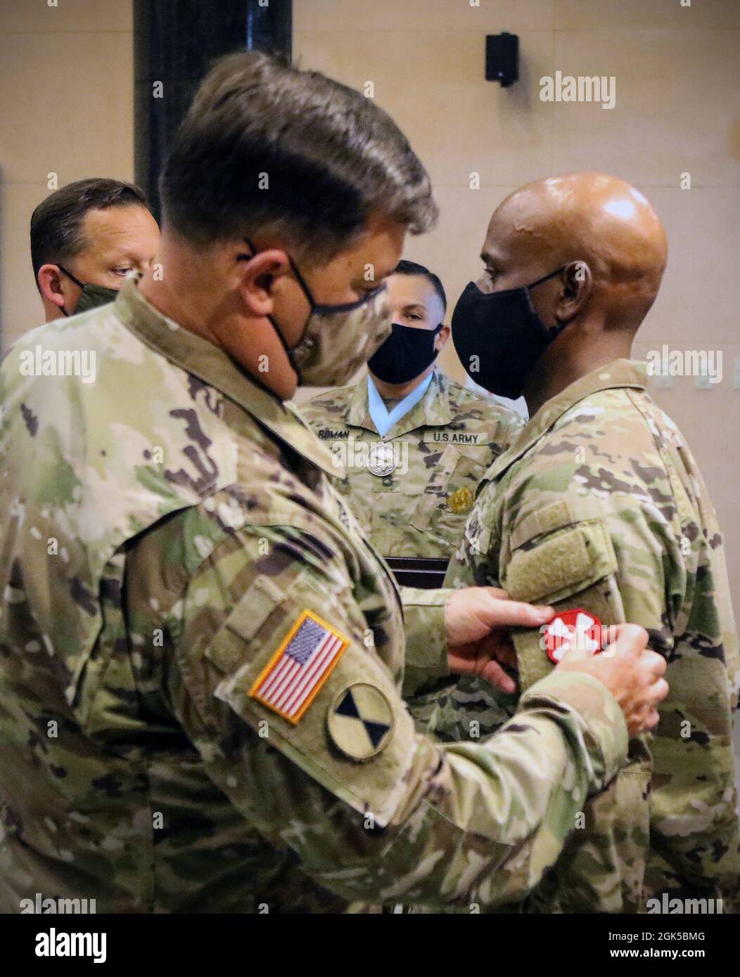 Lt. Gen. Bill Burleson (left), Eighth Army commanding general, places ...