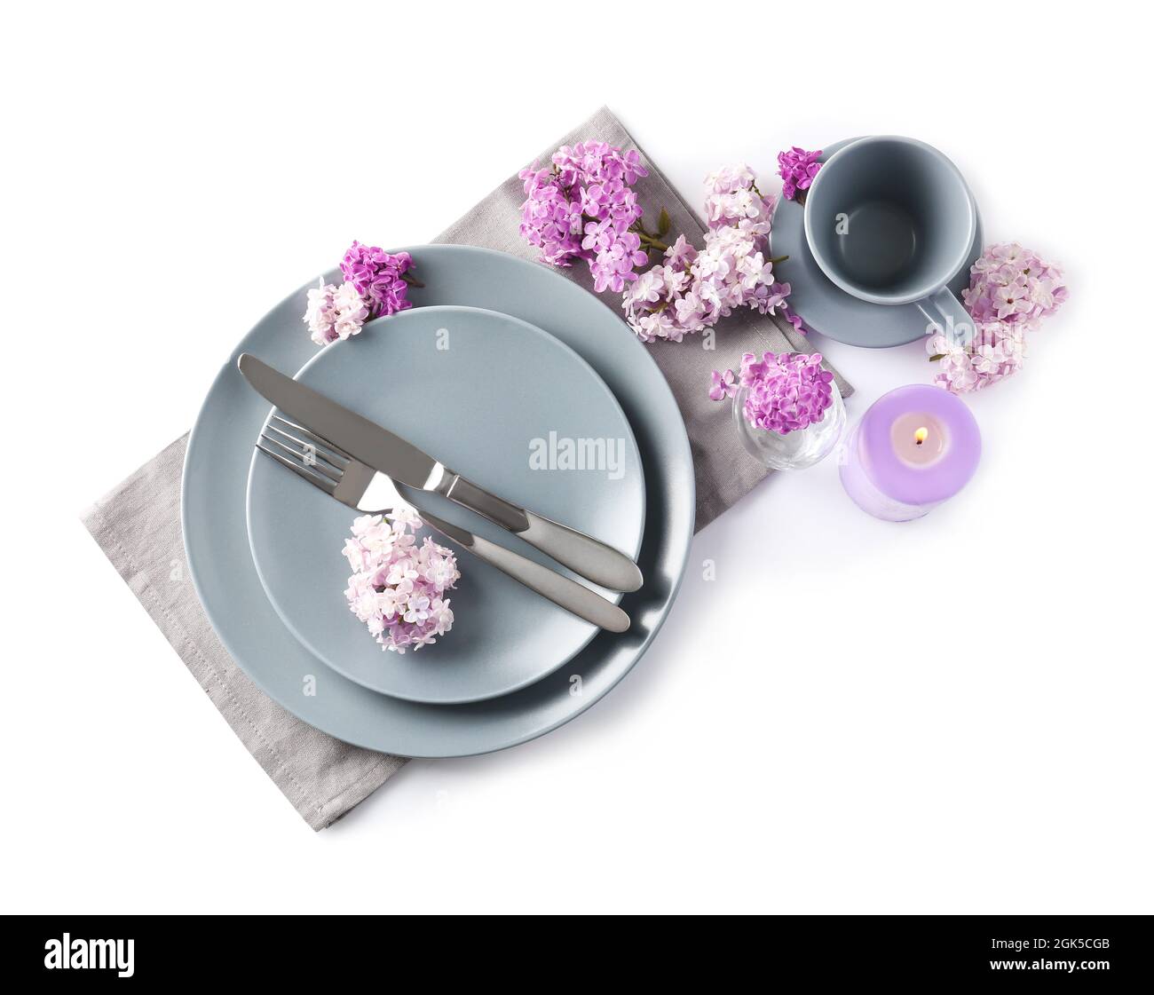 Beautiful festive table setting with lilac flower decor on white ...