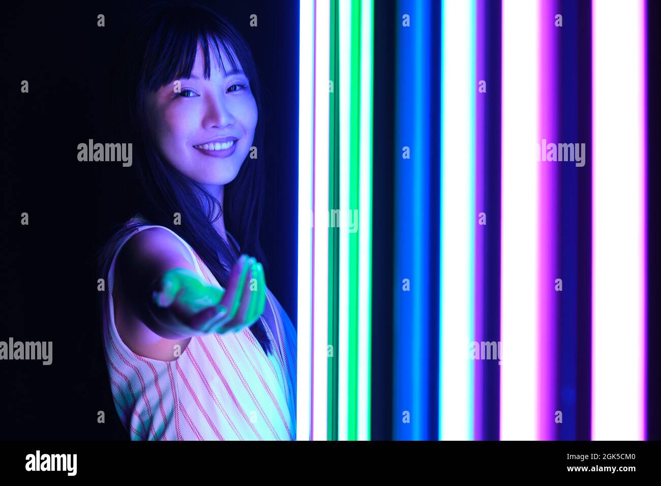 Young asian woman pose with colorful bright neon lights in studio Stock ...