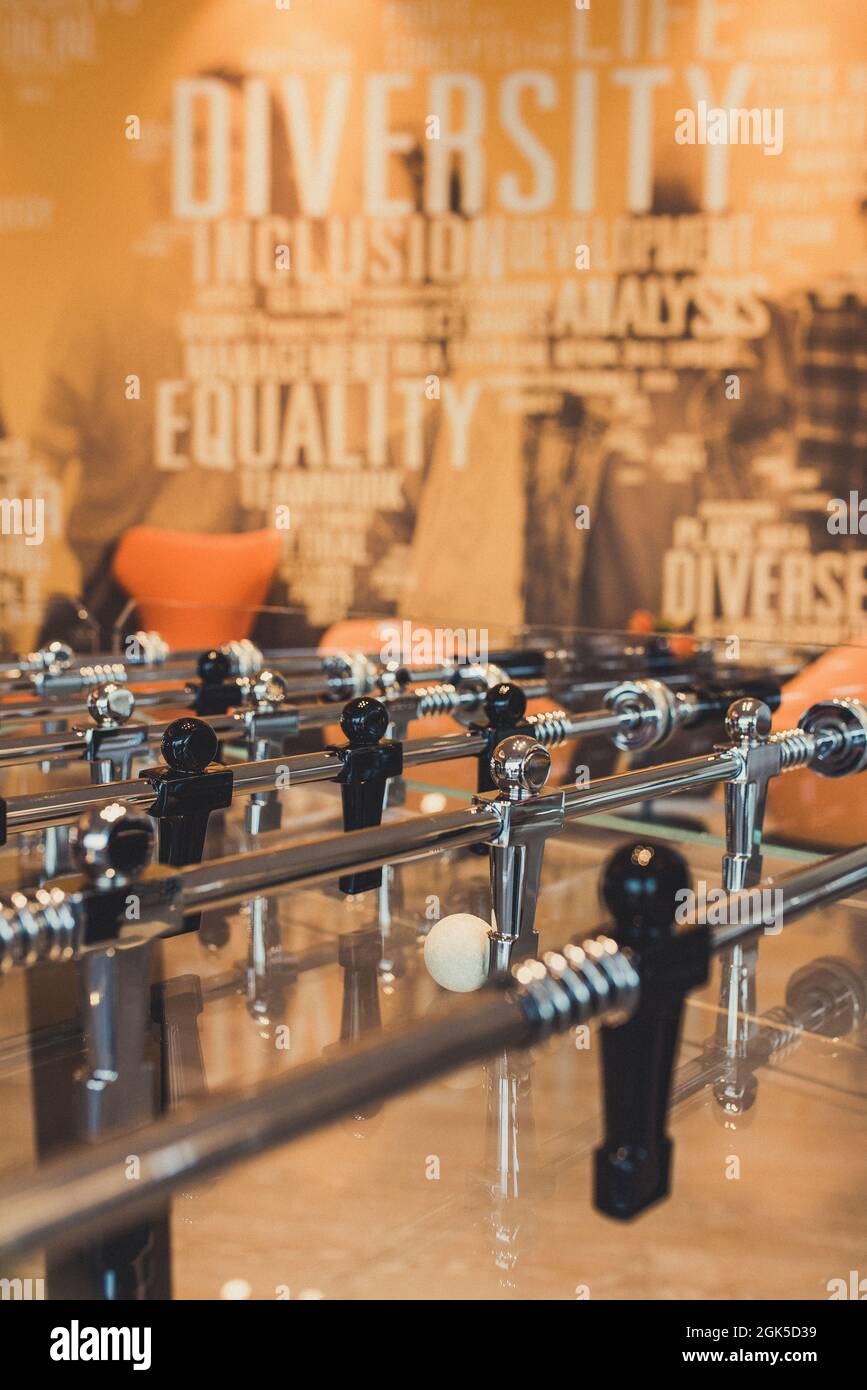 Table soccer game in the pub with diversity and equality concept ...