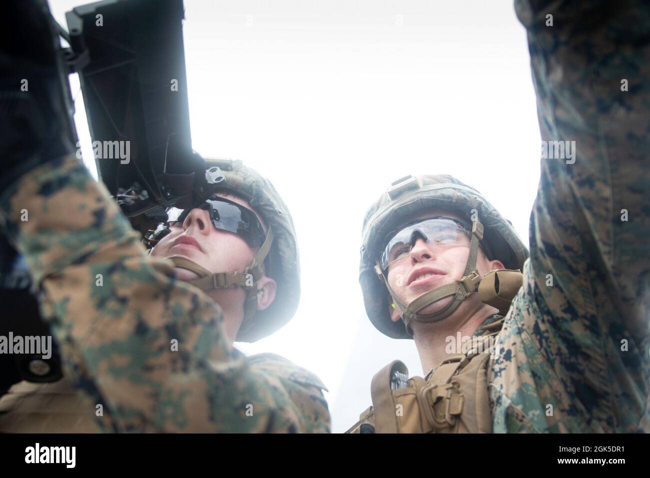 U.S. Marine Corps Lance Cpl. Domonic Mundy and Cpl. Luis Torres, low ...