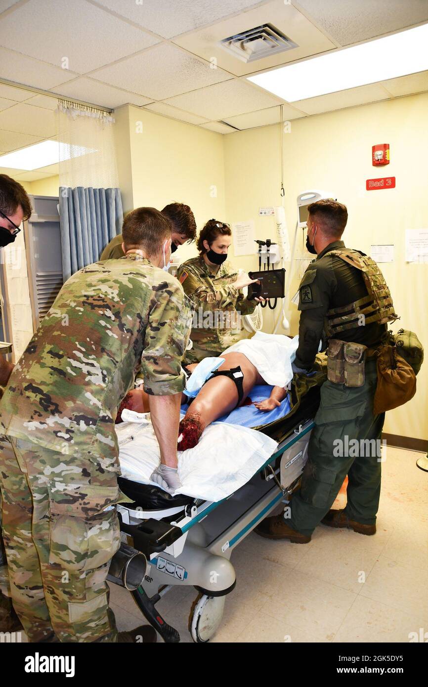 Medics monitor a second iPad with their patient’s vital signs as they ...