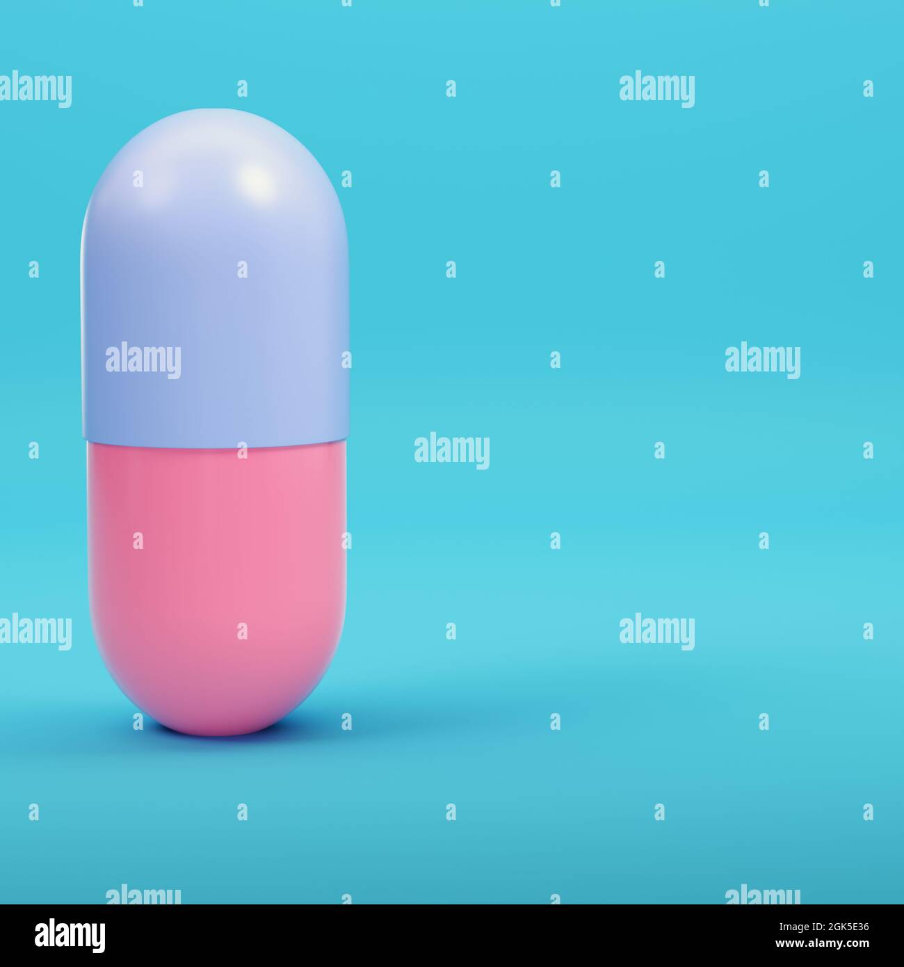Pink capsule pill on bright blue background in pastel colors ...