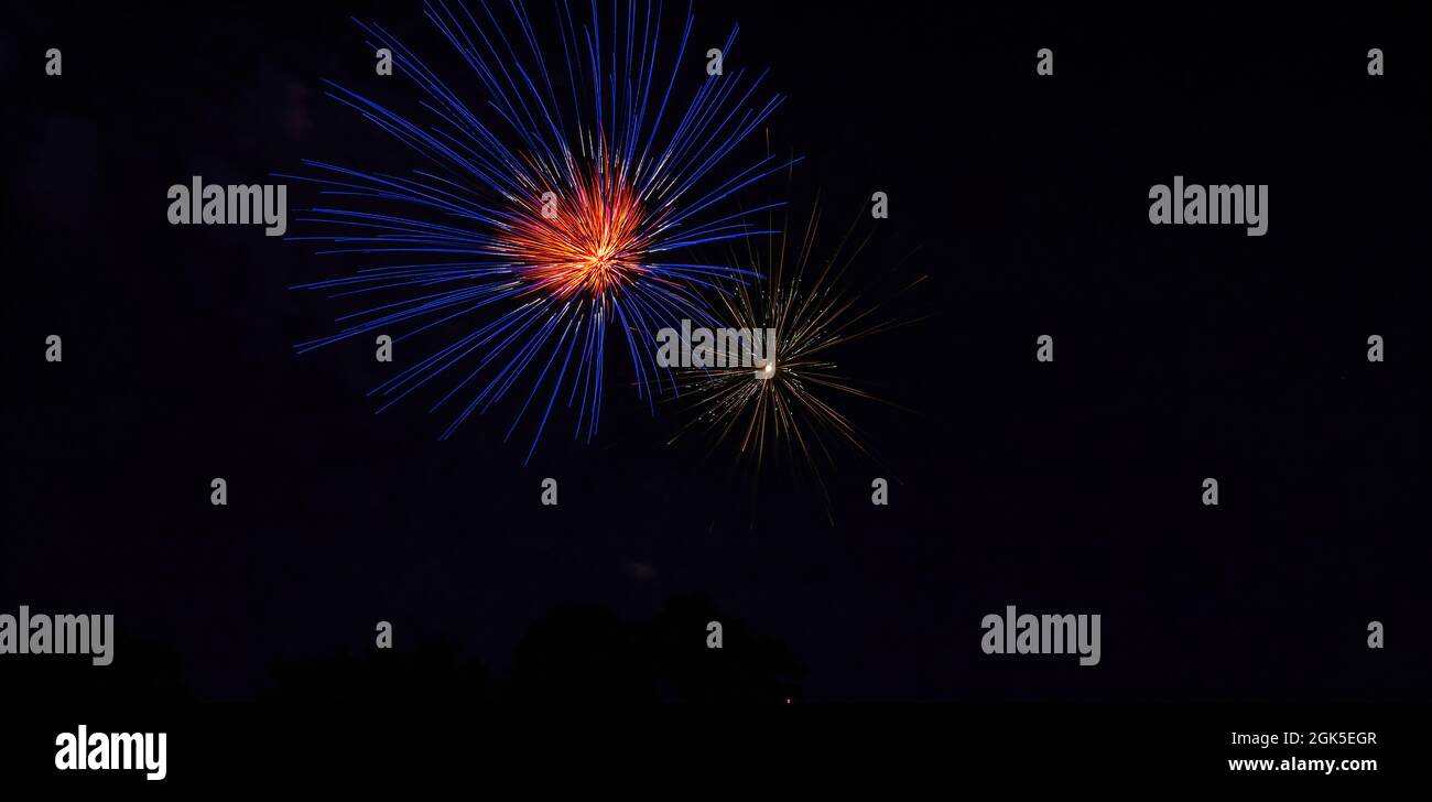 Beautiful fireworks display on a dark night sky Stock Photo - Alamy