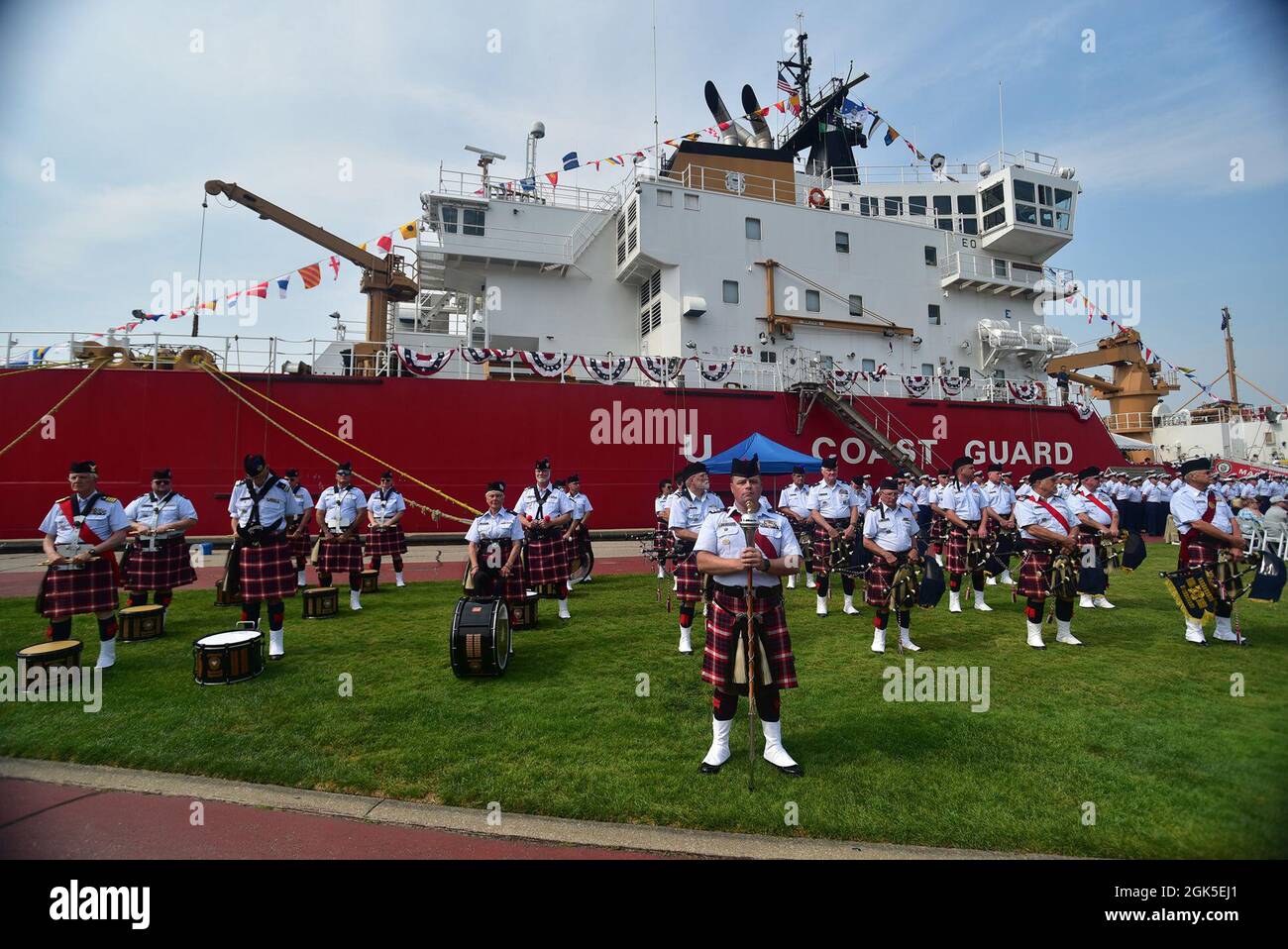 The U.S. Coast Guard Pipe Band stands by prior to performing during the ...