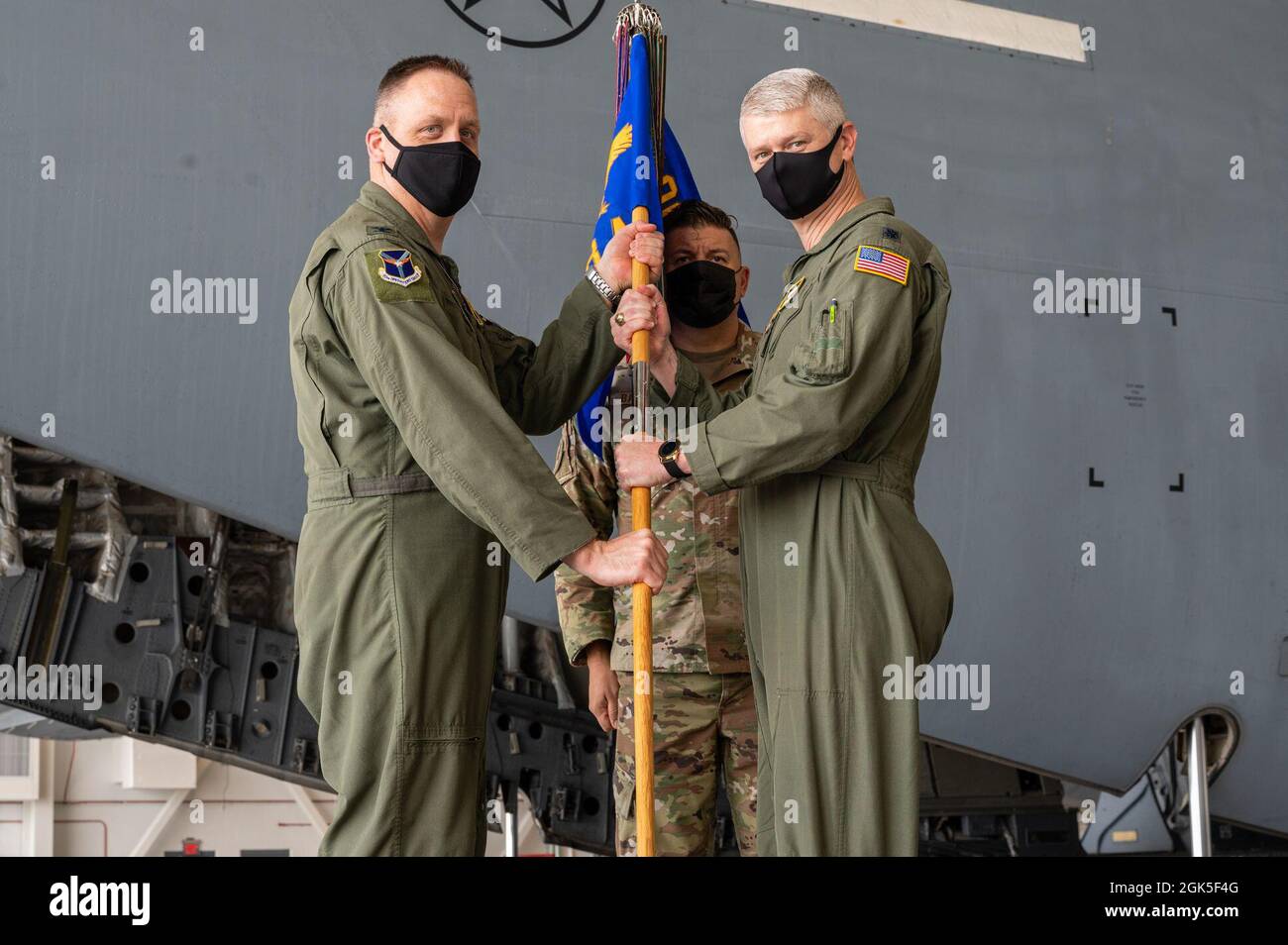 Col. Bryan Bailey, 911th Operations Group commander, passes a guidon to ...