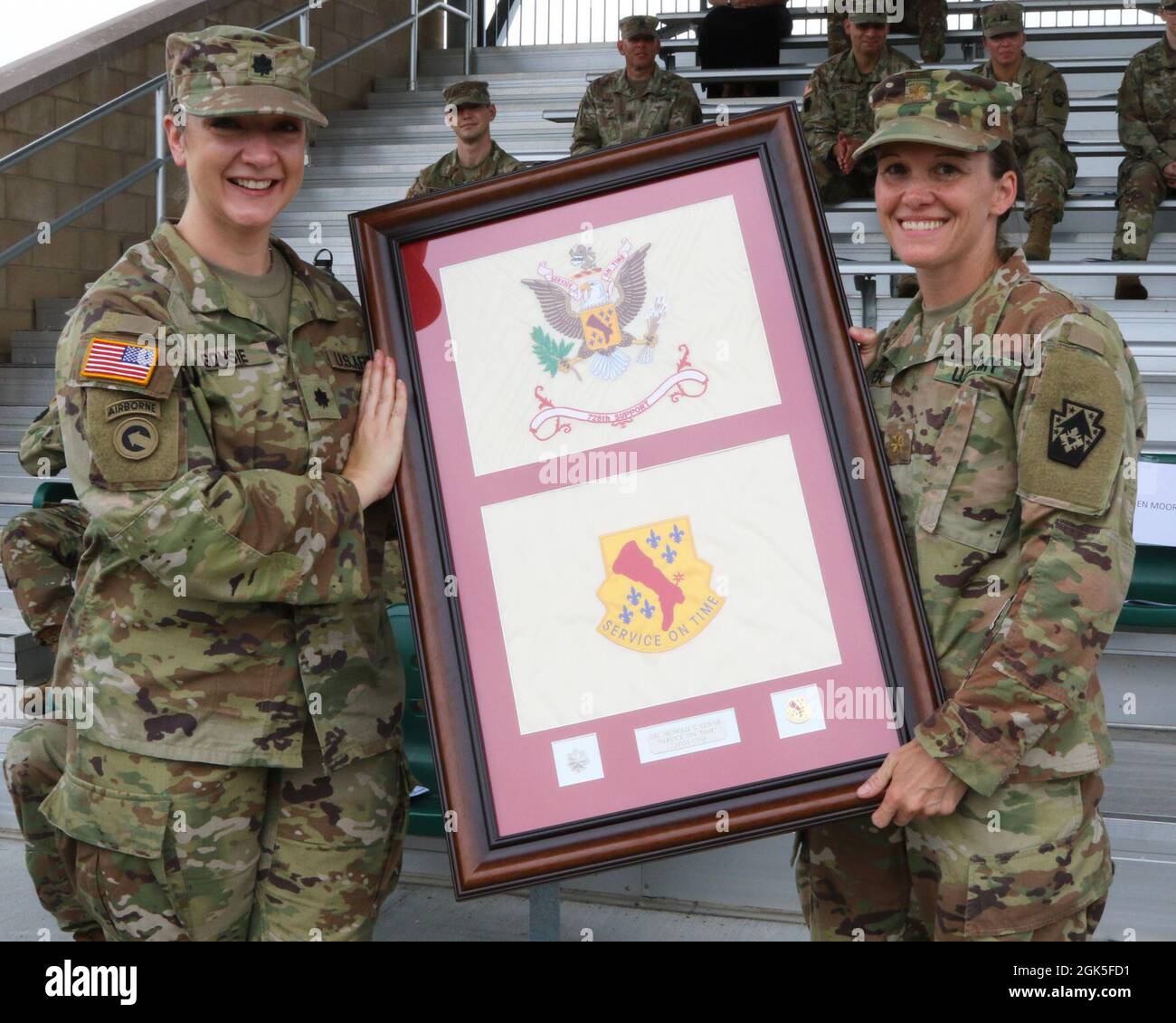 Lt. Col. Nicholle C. Gousie receives an award of recognition during the ...