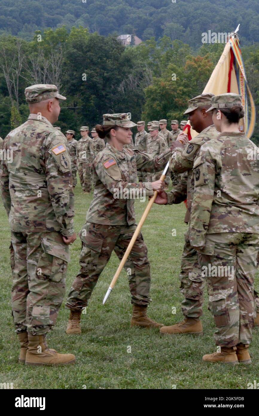 Lt. Col. Dana M. Boyer passes the unit colors to Command Sgt. Maj. John ...