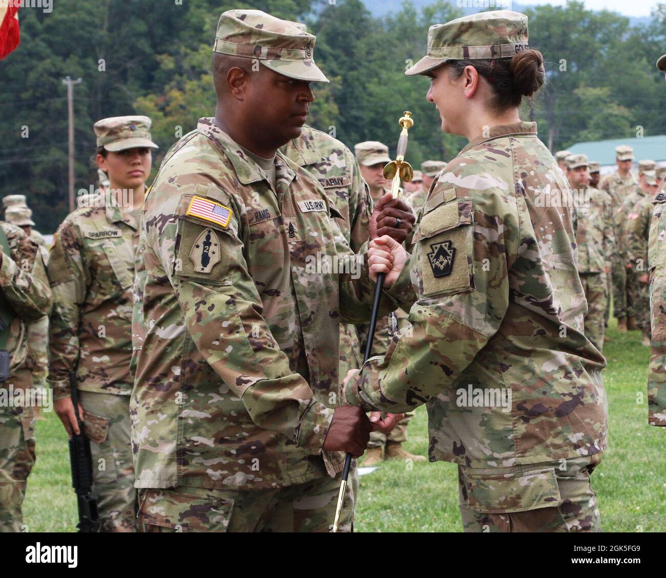 Command Sgt. Maj. John B. Ramos receives the noncommissioned officer's ...