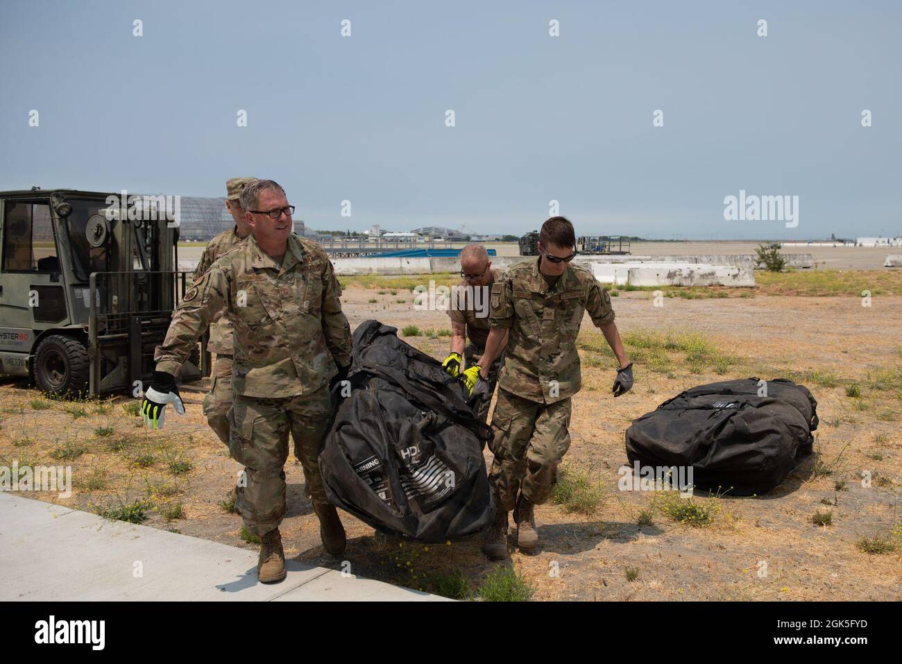 U.S. Air Force Airmen and California State Guard assigned to the 129th ...