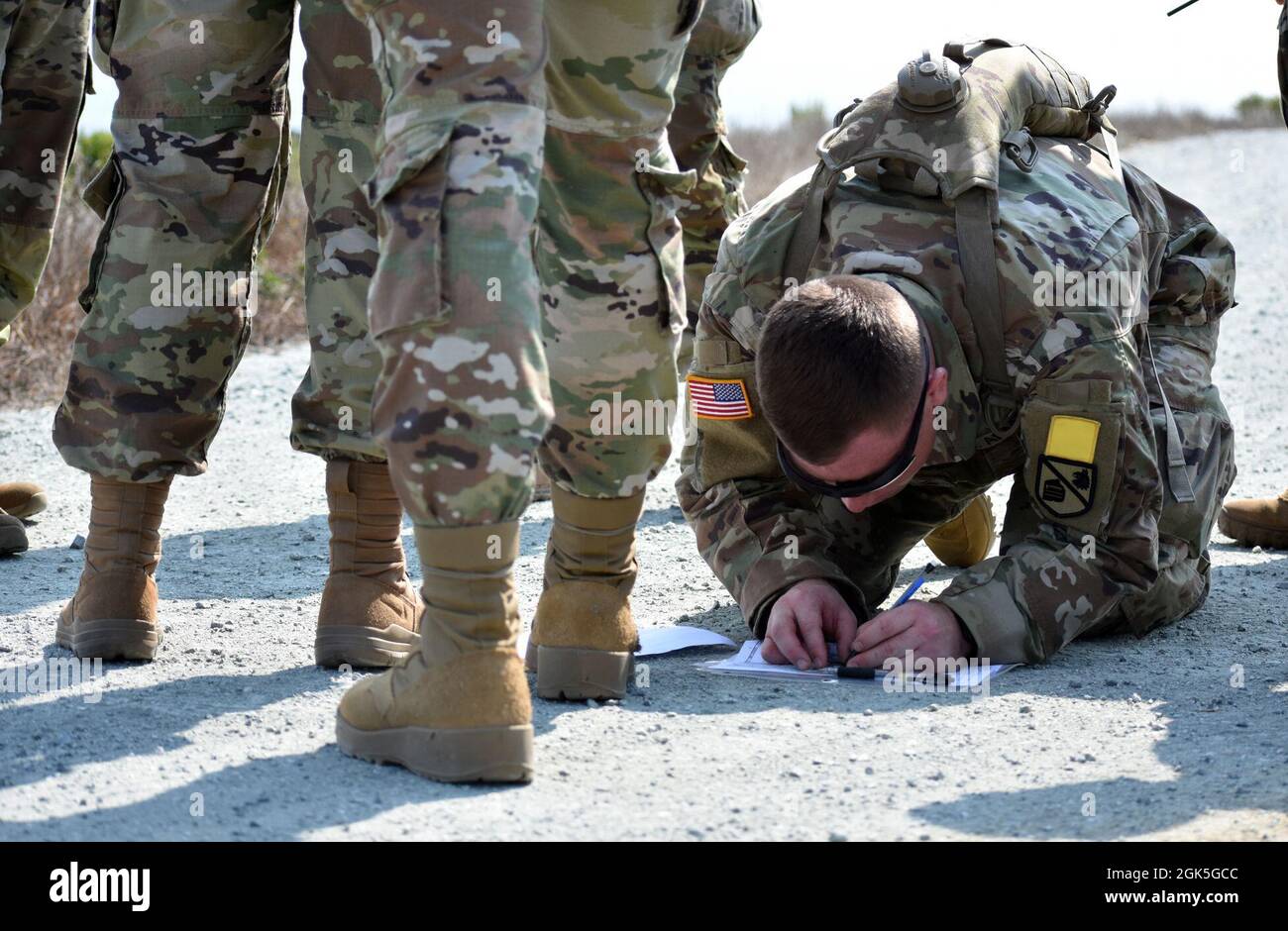 A Soldier assigned to the 229th Military Intelligence Battalion helps ...