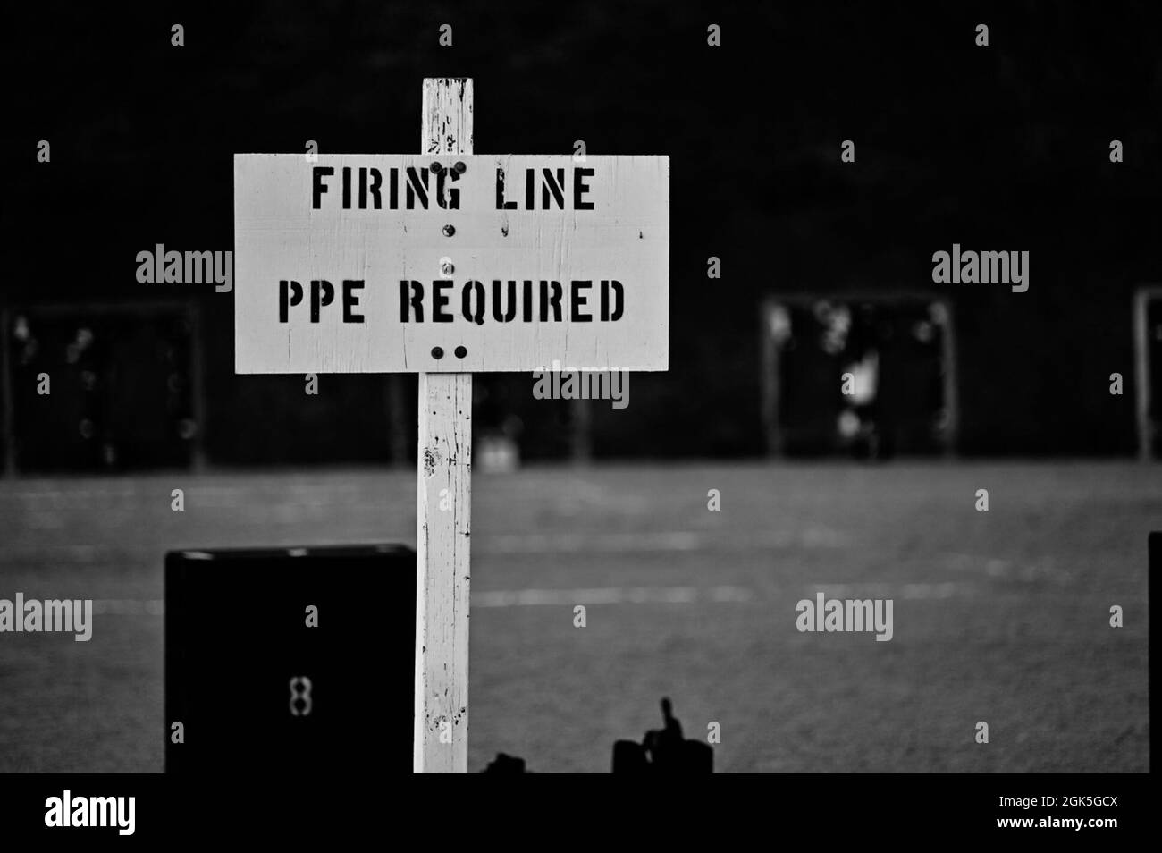 A firing-line sign stands on a firing range at Camp San Luis Obispo ...