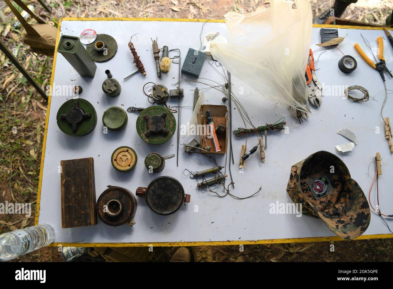 A U.S. Marine Corps eight-point cover sits on a table with anti ...