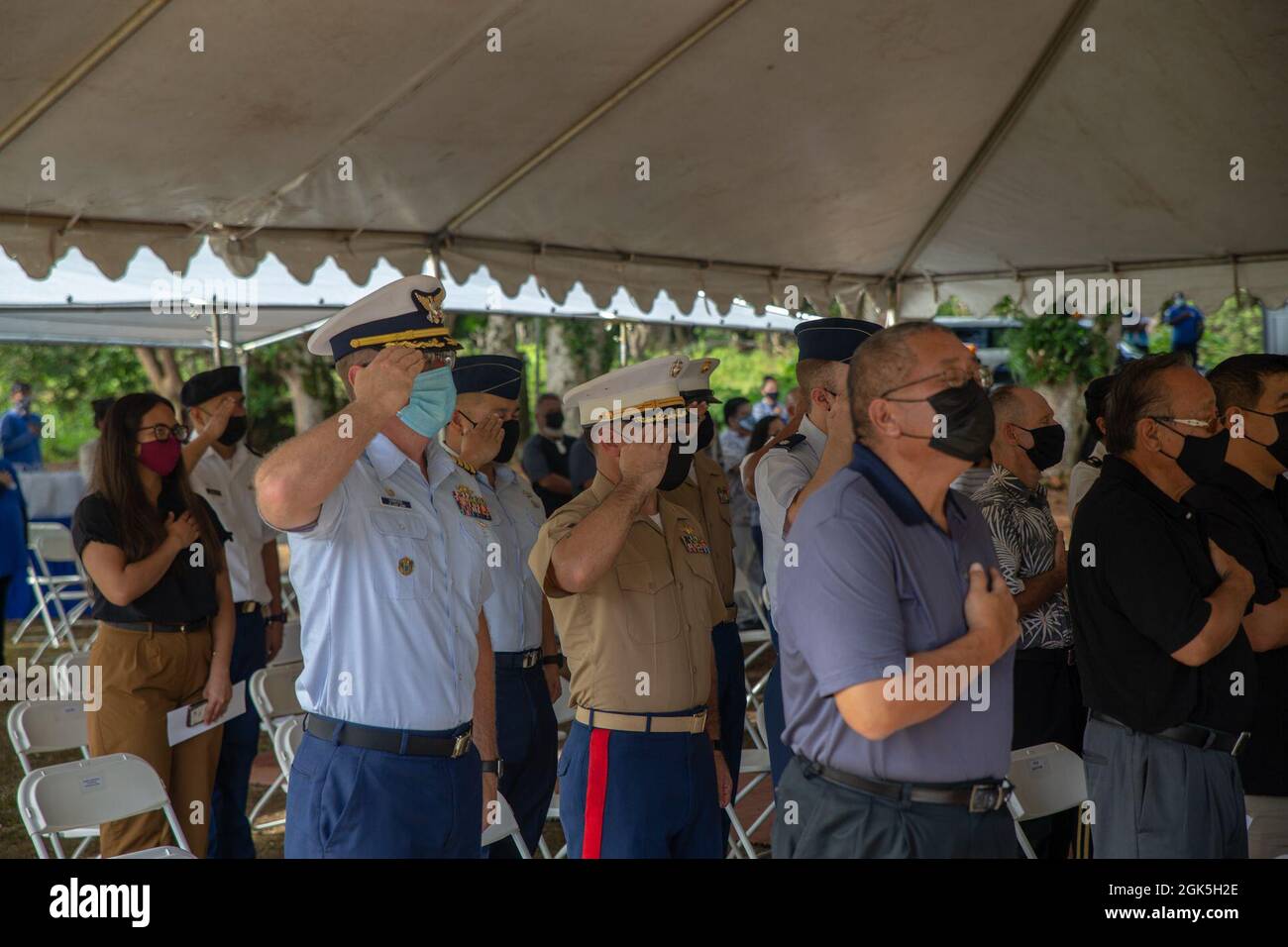Senior leaders render a salute during the playing of the national ...