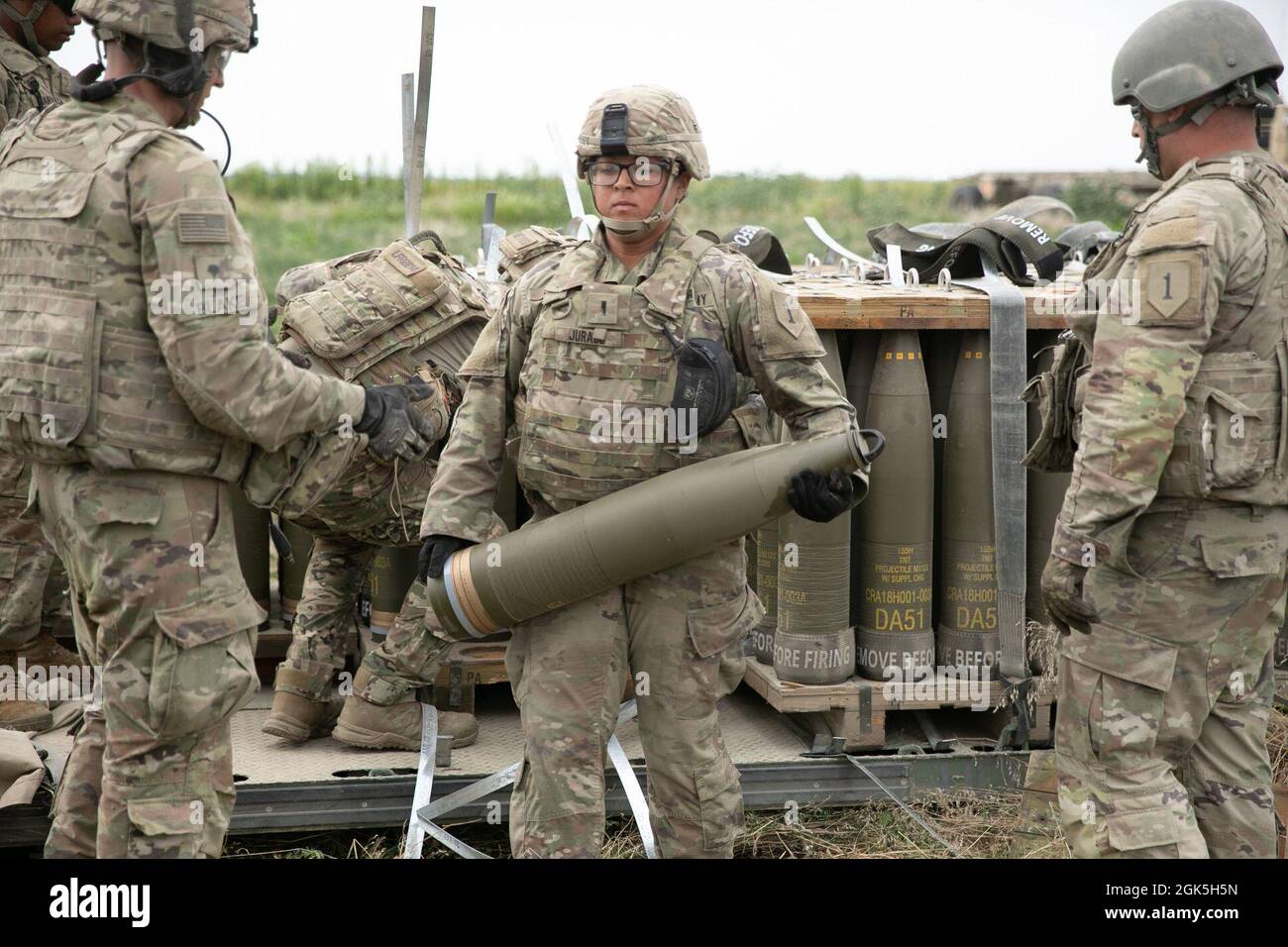 1LT Jurado from Bravo 1-7 FA FDC Lifts a 155mm Howitzer Round to ...