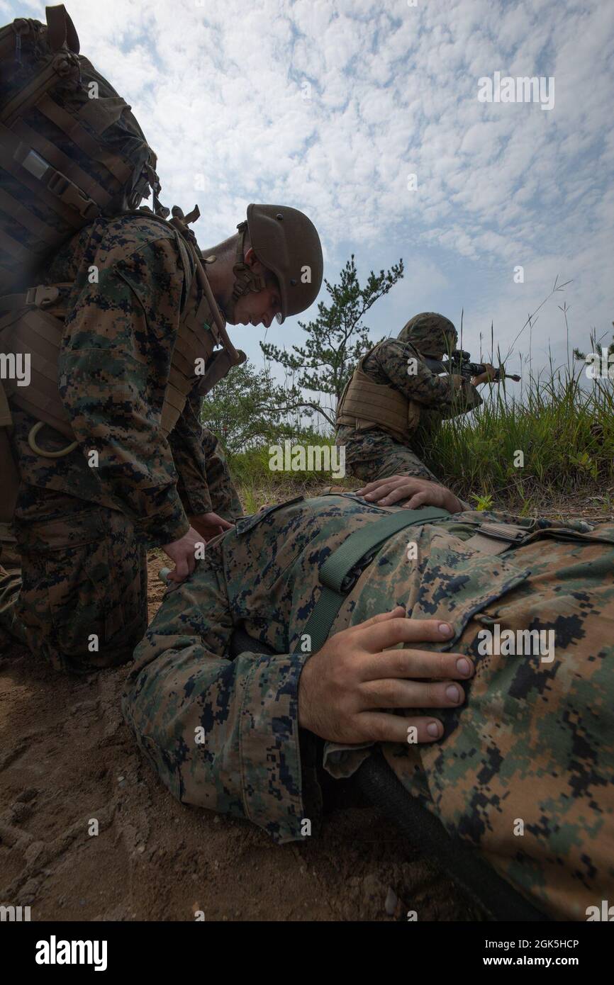 A U.S. Navy Corpsman with Combat Logistics Battalion 451, 4th Marine ...