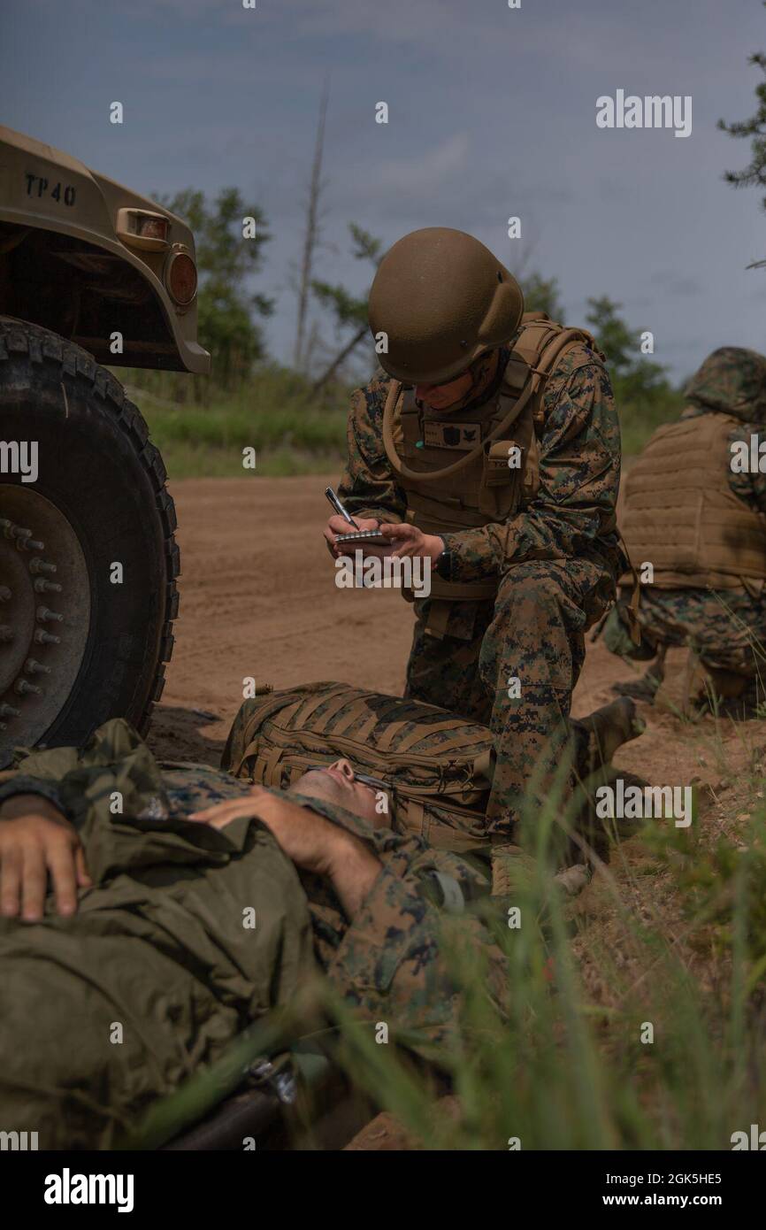 A U.S. Navy Corpsman with Combat Logistics Battalion 451, 4th Marine ...