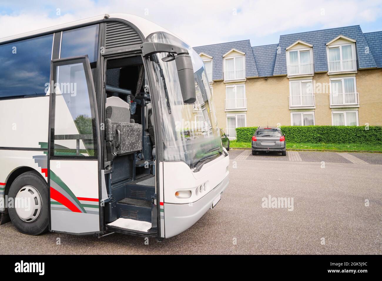 Big tourist bus on parking Stock Photo - Alamy