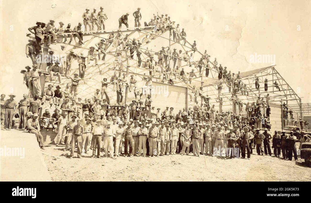 Workers with the Brown and Root Steel Crew are seen surrounding a new ...