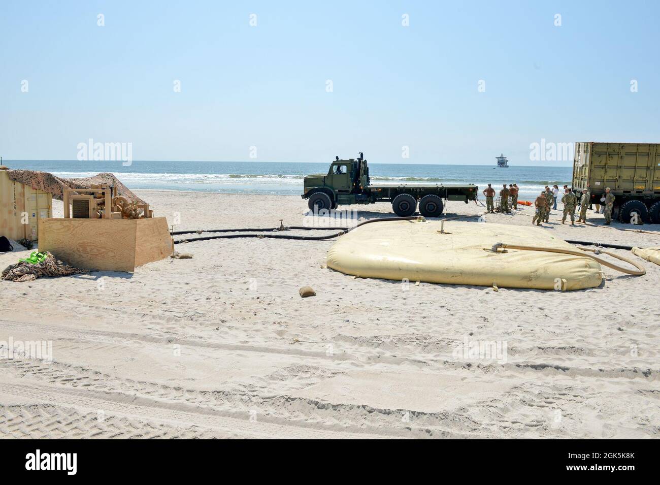 A 20,000 gallon collapsible fabric tank is filled with salt water as a ...