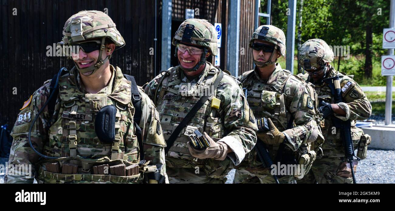 U.S. Soldiers line up to fire their M4 carbine rifles during the U.S ...