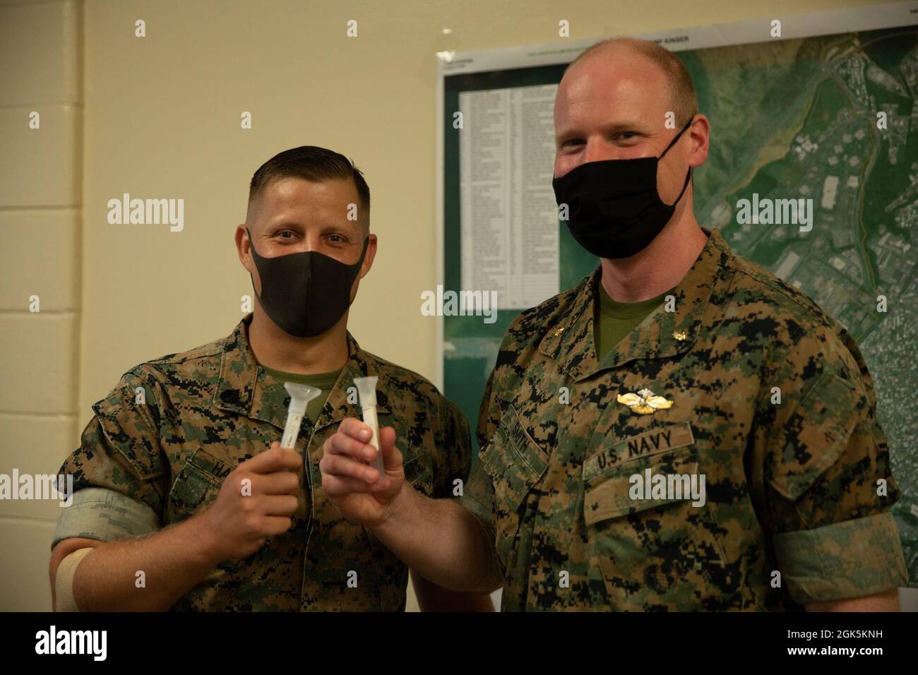U.S. Marine Corps Staff Sgt. Jacob Hanson, left, Headquarters Company ...