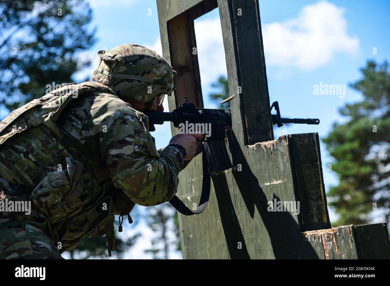 A U.S. Soldier fires his M4 carbine rifle at a target during the U.S ...