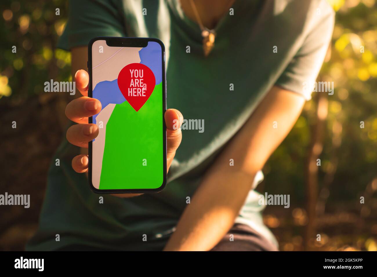 Hiking with mobile phone and digital maps on the screen. Safe adventure ...