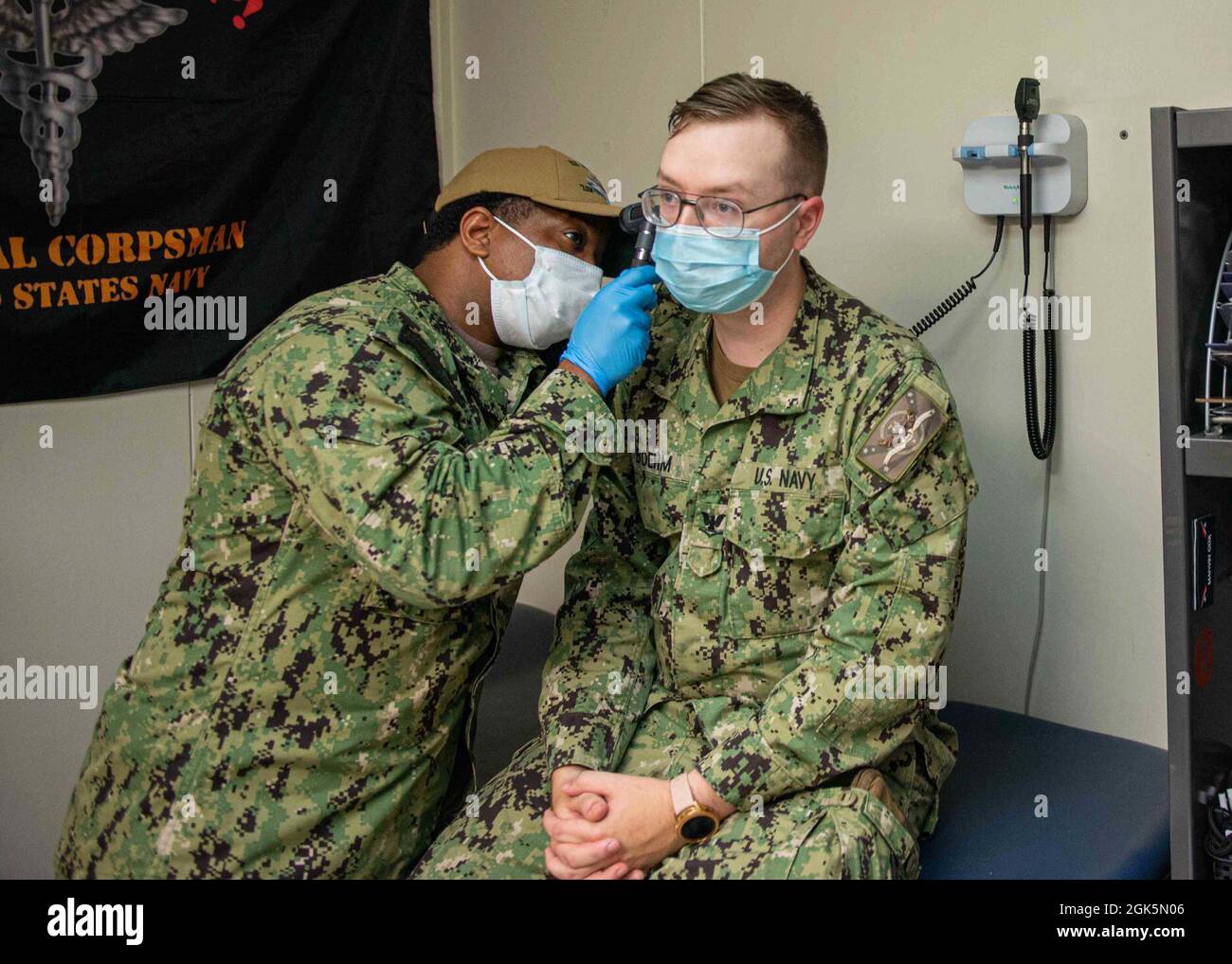 U.S. Navy Hospital Corpsman 1st Class Marvin Cox, left, from New York ...