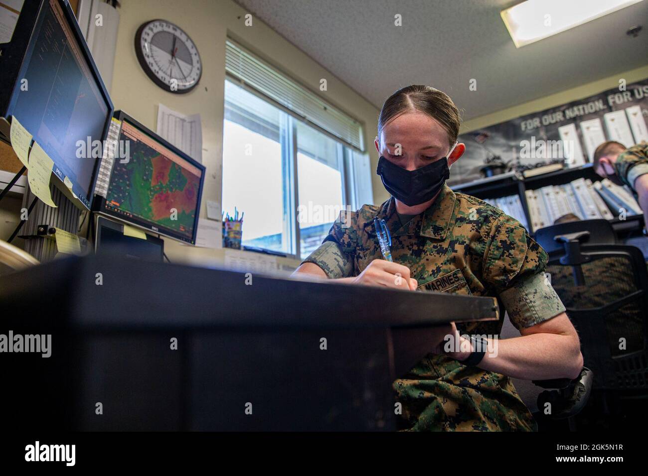 U.S. Marine Corps Cpl. Julia Hubler, a meteorological and oceanography ...