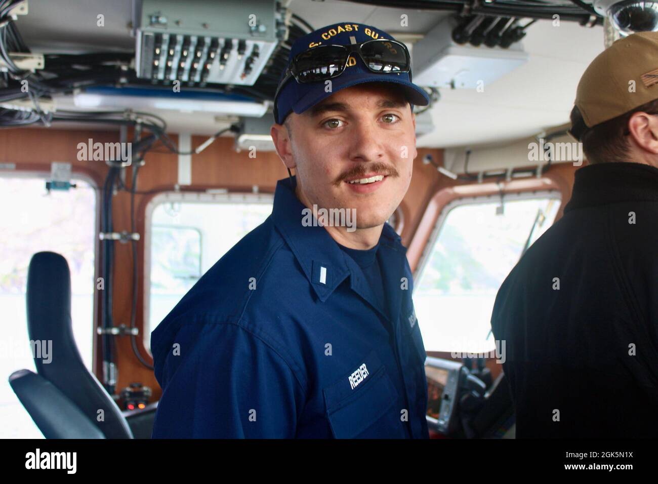 Lt. j.g. Dustin Reeder takes a moment for a photo on USCGC Richard ...