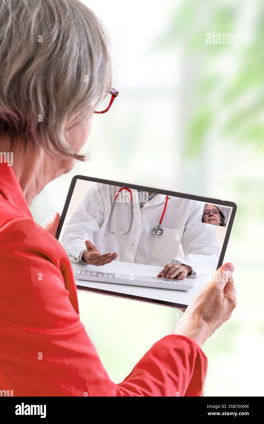 Remote consultation- Doctor sitting at hospital, with laptop, having an ...