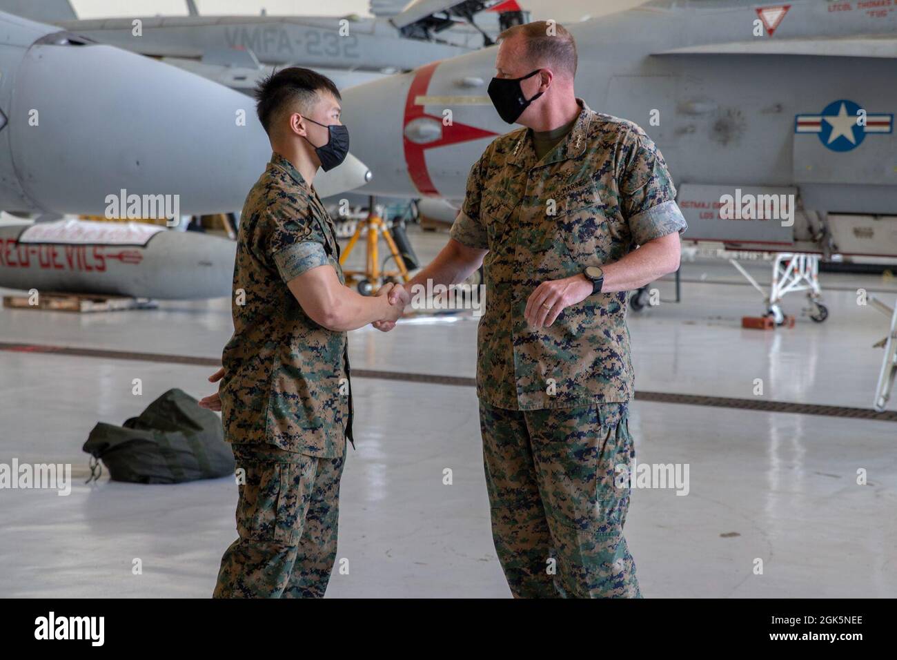Lt. Gen. Mark Wise, the Deputy Commandant for Aviation, right, presents ...