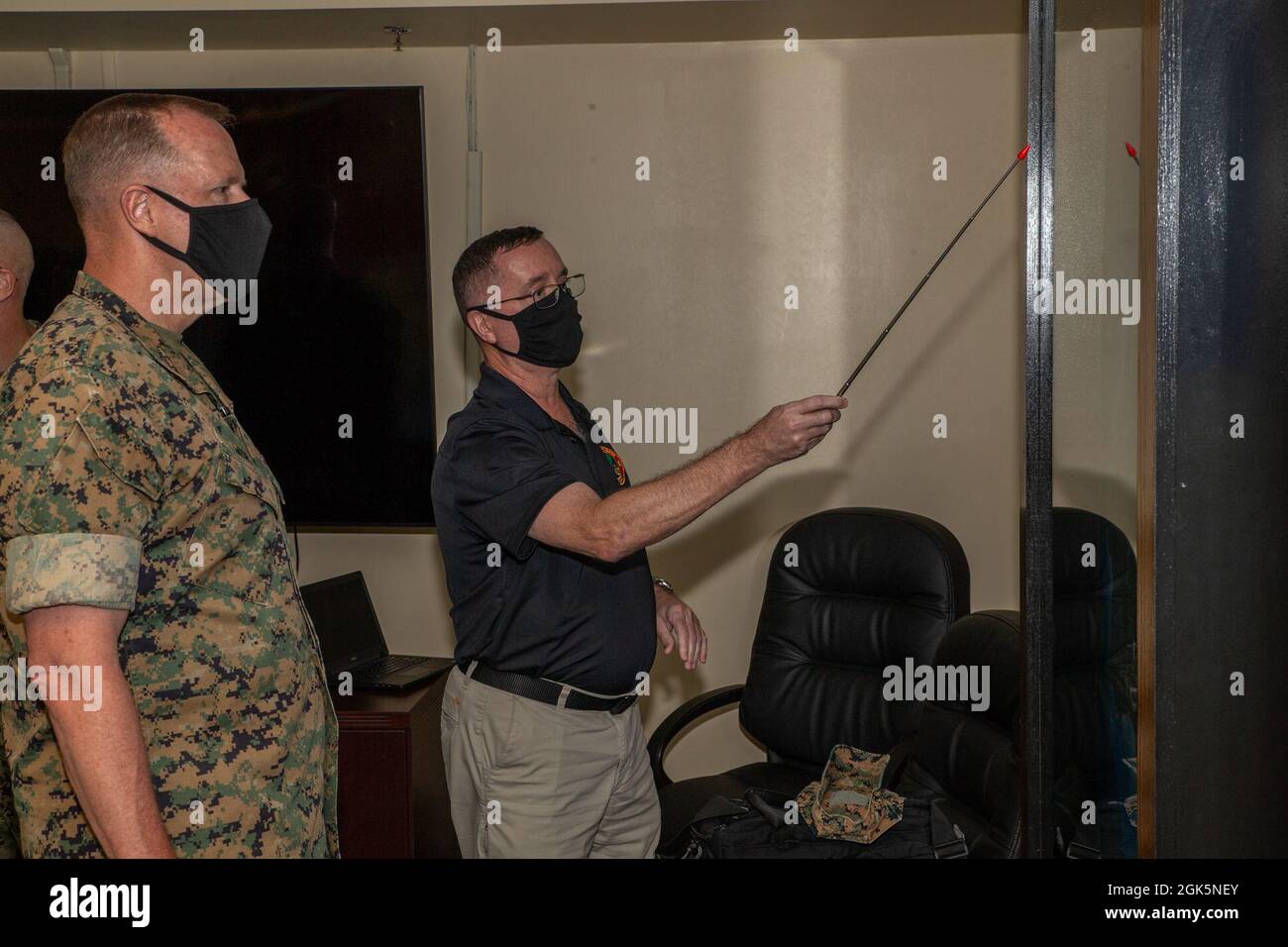 Don Baldwin, the Marine Corps Base (MCB) Camp Blaz Chief of Staff, briefs Lt. Gen. Mark Wise ...