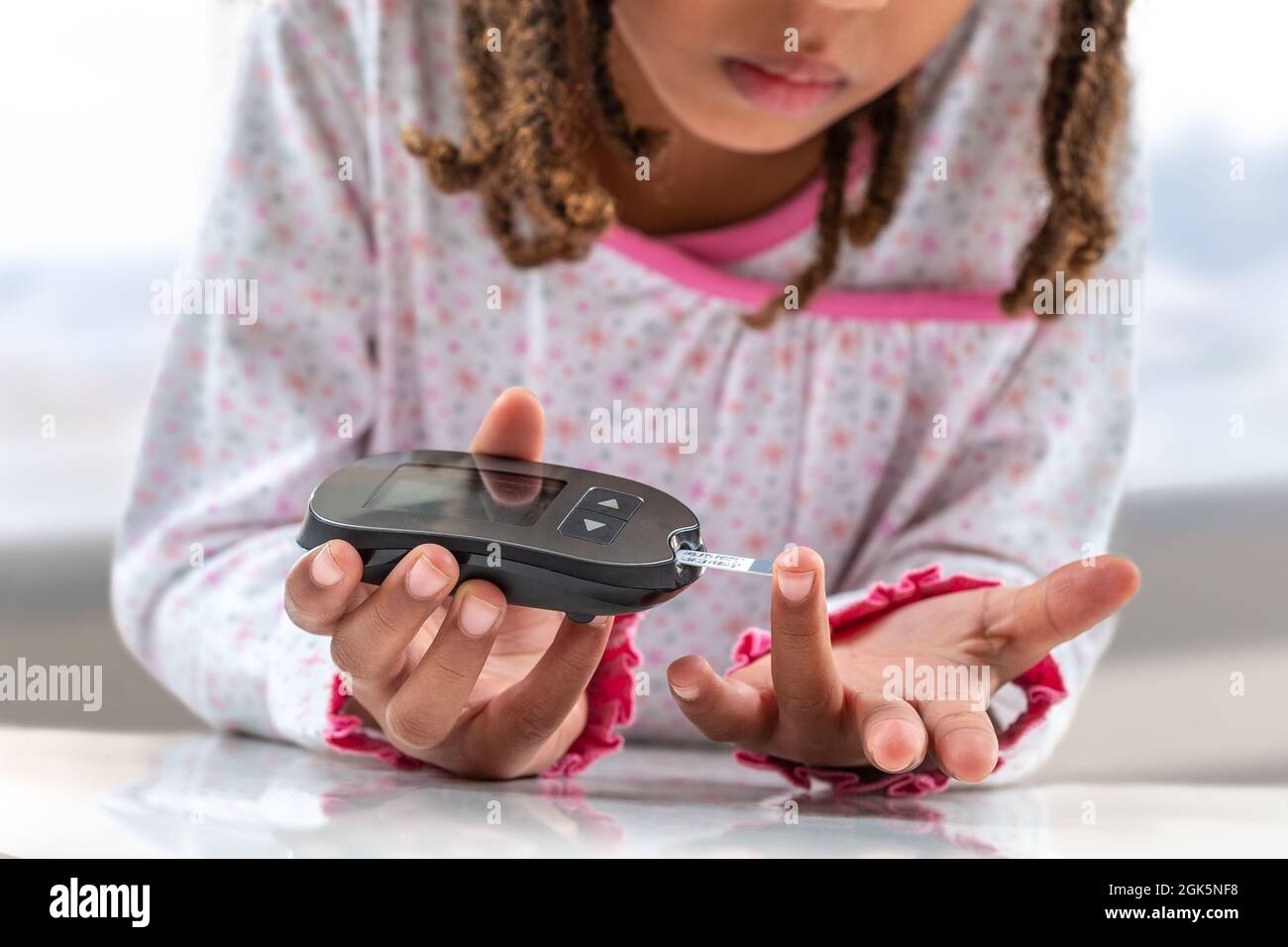 Concept children diabetes children with glucometer learning to check ...