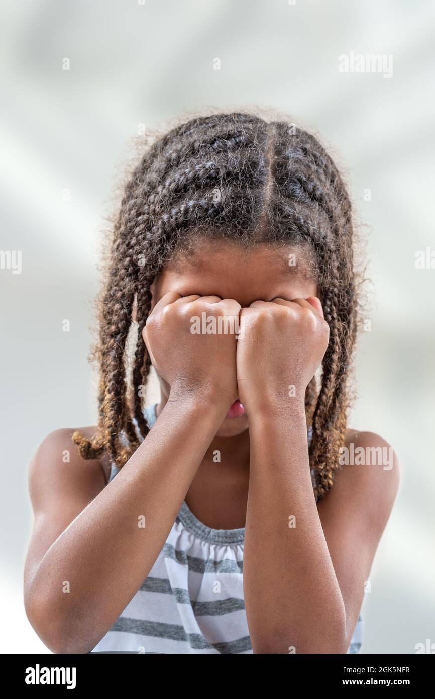 Little girl doing facial expressions face on white Stock Photo - Alamy