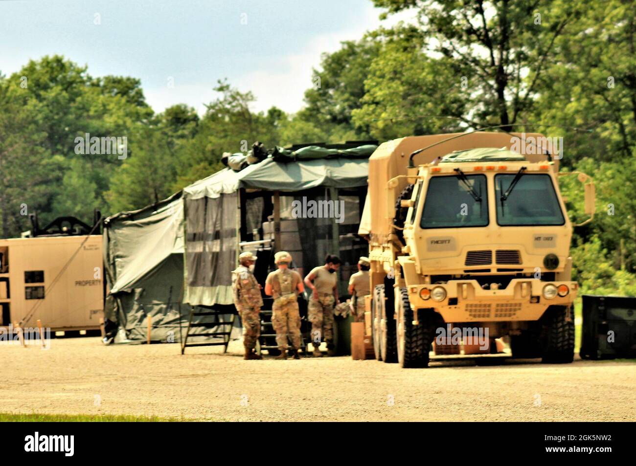 Soldiers prepare a mobile kitchen trailer for use Aug. 9, 2021, as part ...
