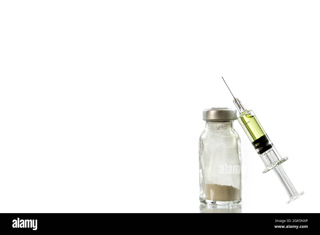 Medicine bottles glass and syringe injection needle on white background ...