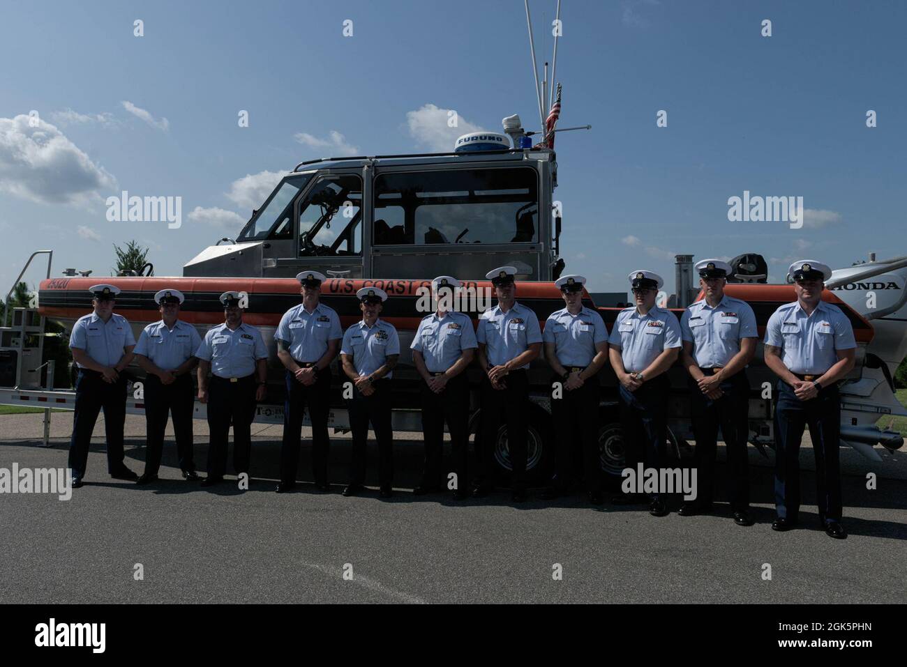 The crew of Station Memphis stand in front of a 29-foot Response Boat ...
