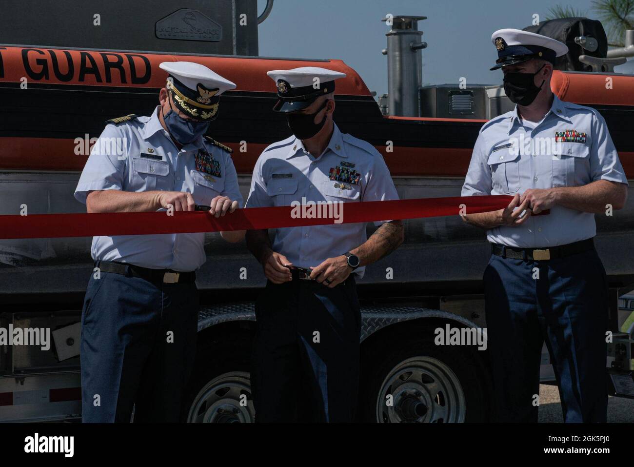 Capt. Ryan Rhodes, Sector Lower Mississippi commander, and Petty ...