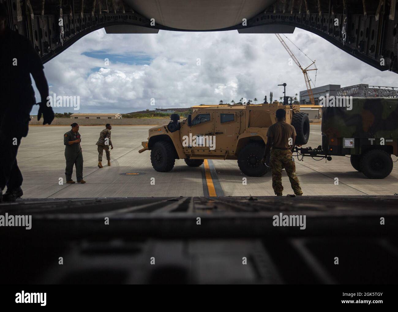 U.S. Airmen with the 535th Airlift Squadron, ground guide a U.S. Marine ...