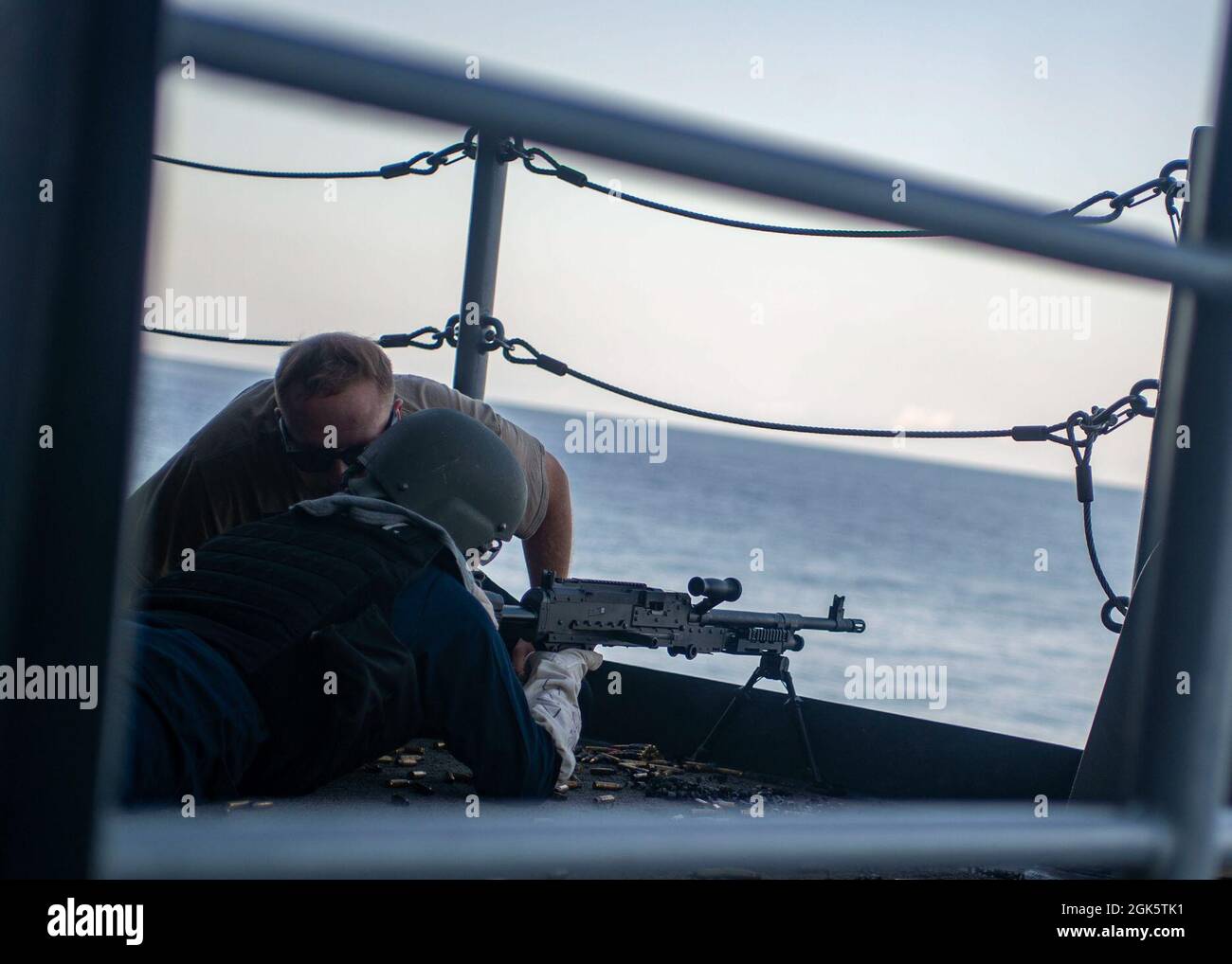 Gunner's Mate 1st Class Dustin Jones, top, from Dayton, Ohio, assigned ...