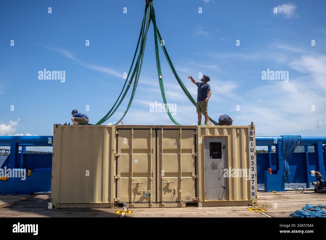 Sailors, assigned to Mobile Diving Salvage Unit (MDSU) 2, load a ...