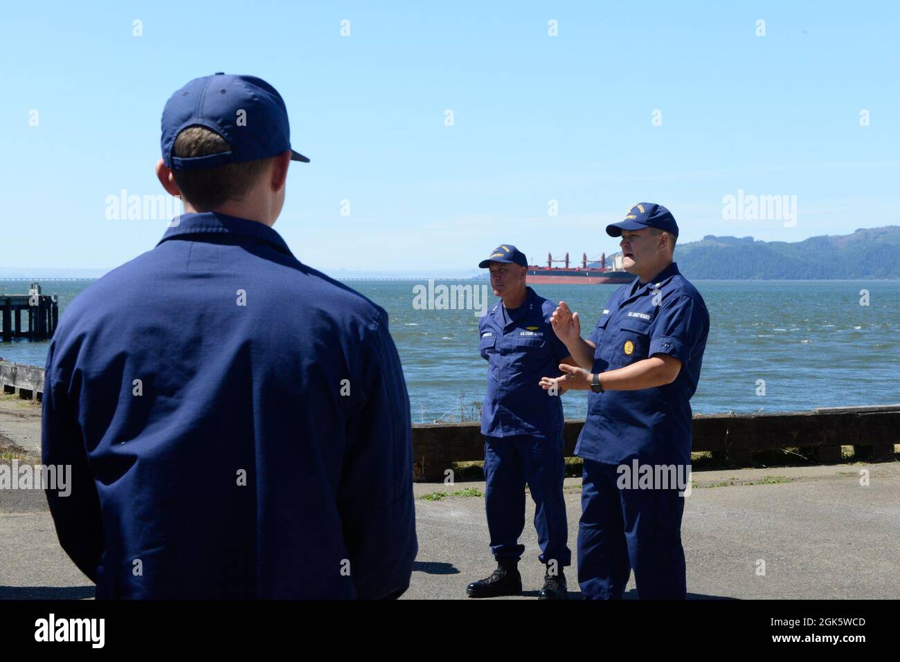 13th District Command Master Chief Shane Carroll speaks to the crew of ...