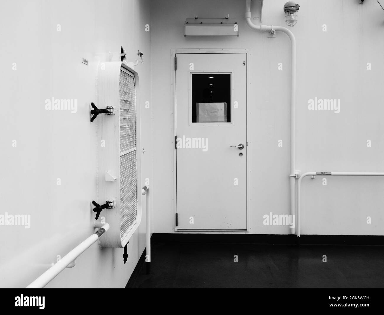 Clean white modern vessel ship closed door black deck floor with air ...
