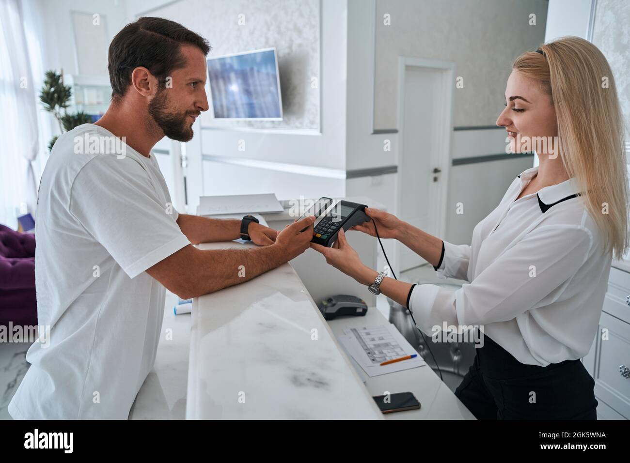 Serious male receptionist hi-res stock photography and images - Alamy